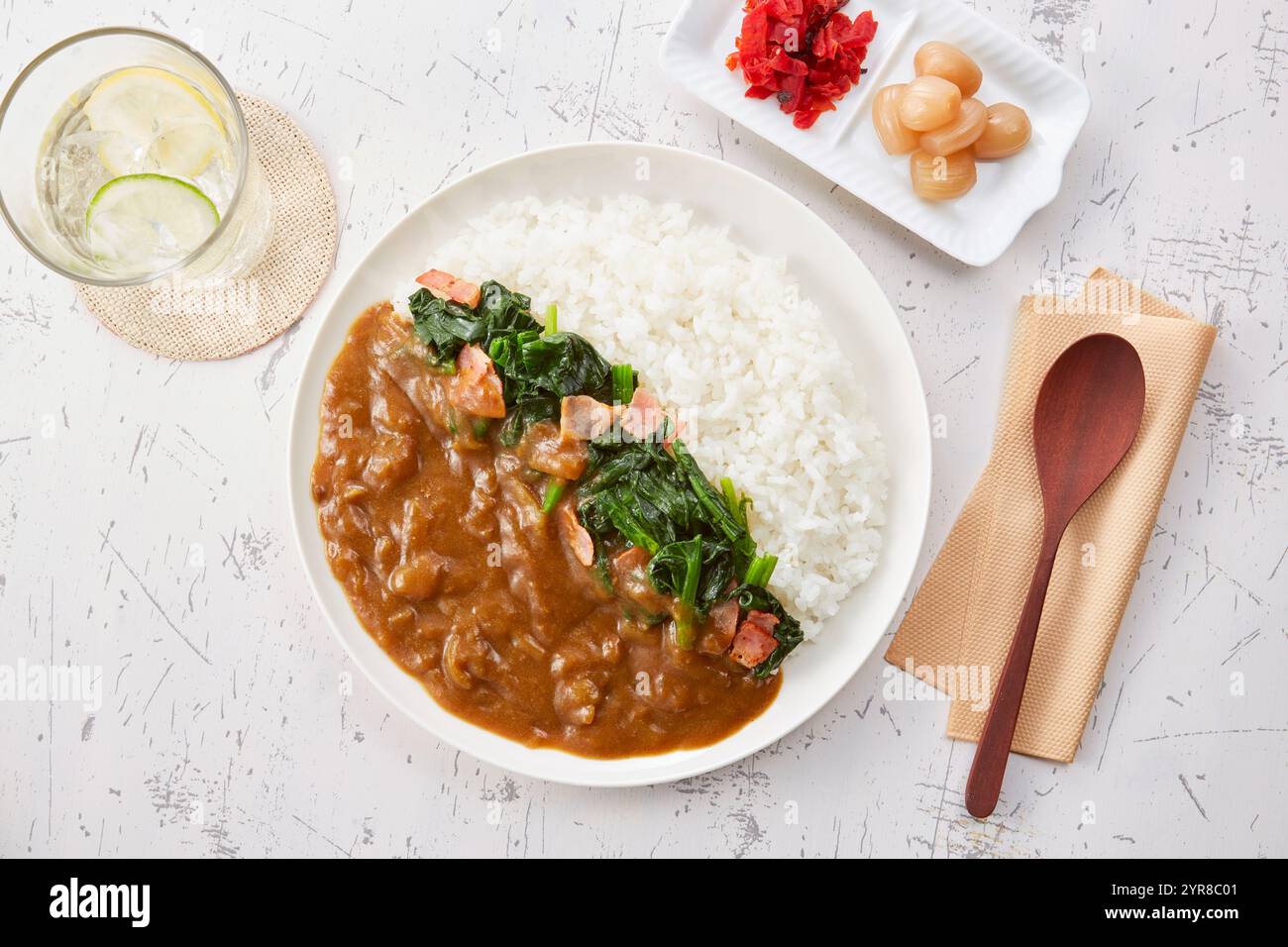 Curry rice with spinach topping Stock Photo - Alamy