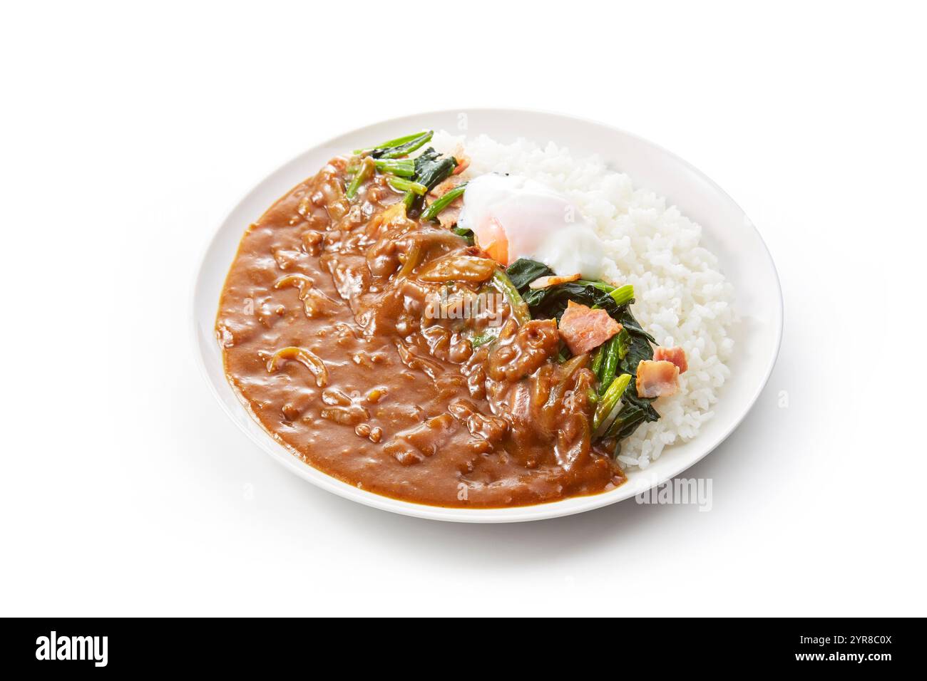 Curry rice with spinach and egg topping Stock Photo - Alamy