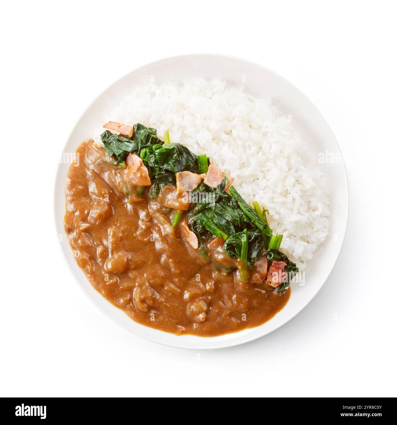 Curry rice with spinach topping Stock Photo - Alamy