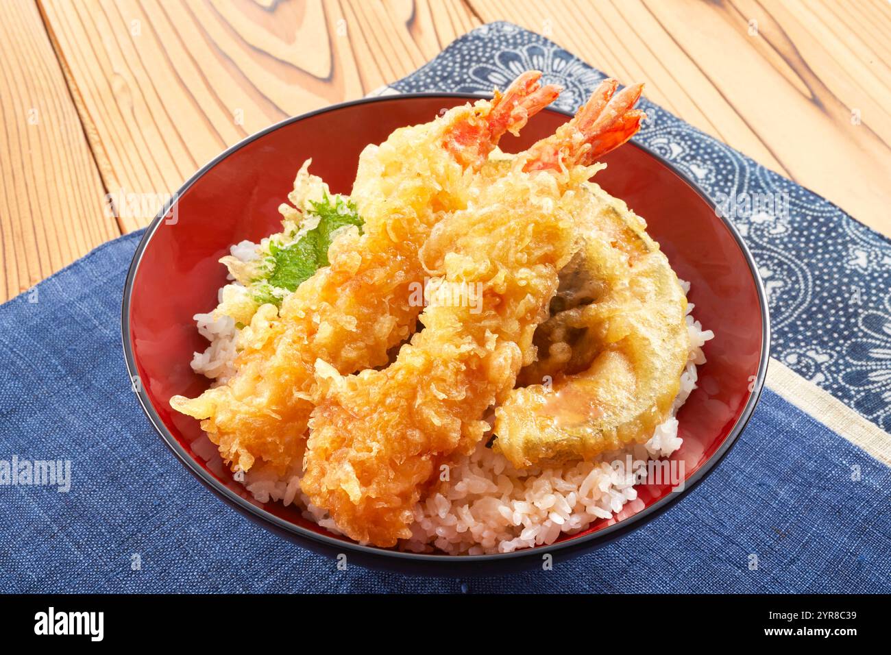 Tempura served over rice in a bowl (prawns, kabocha, shiitake mushrooms ...