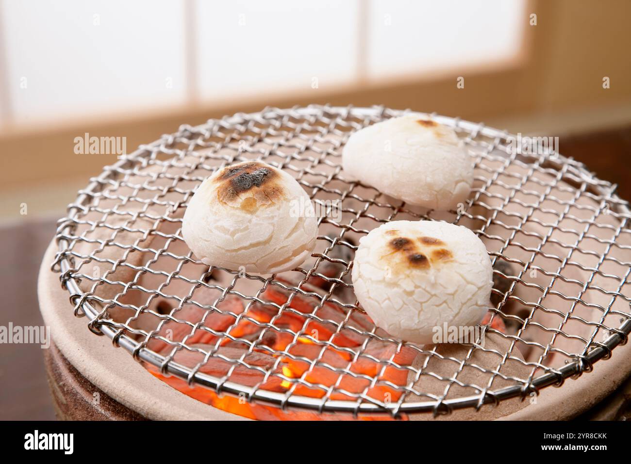 Mochi slowly baked in a shichirin Stock Photo - Alamy