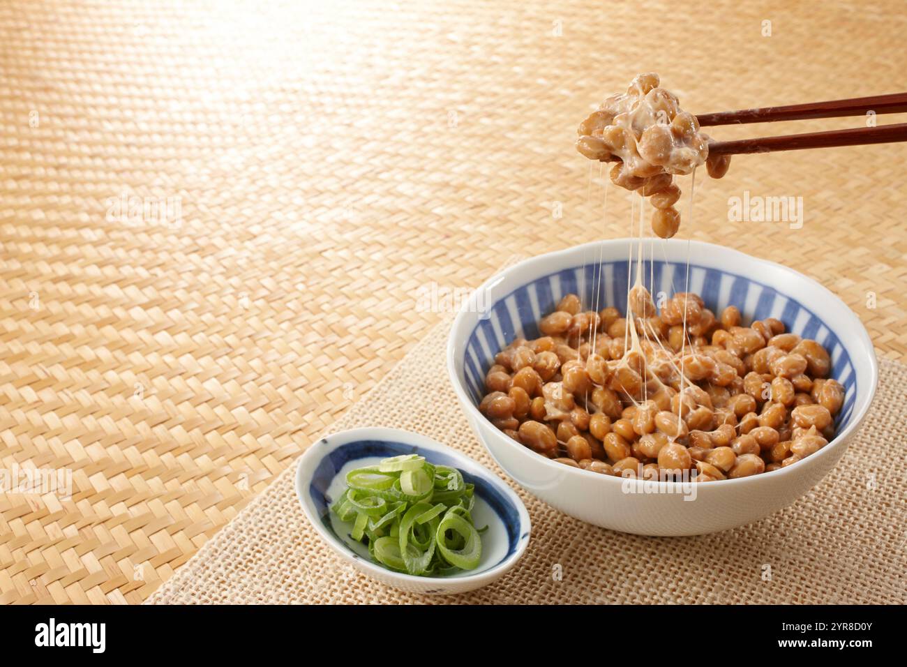 Mito natto (fermented soybeans) with chopsticks raised Stock Photo - Alamy