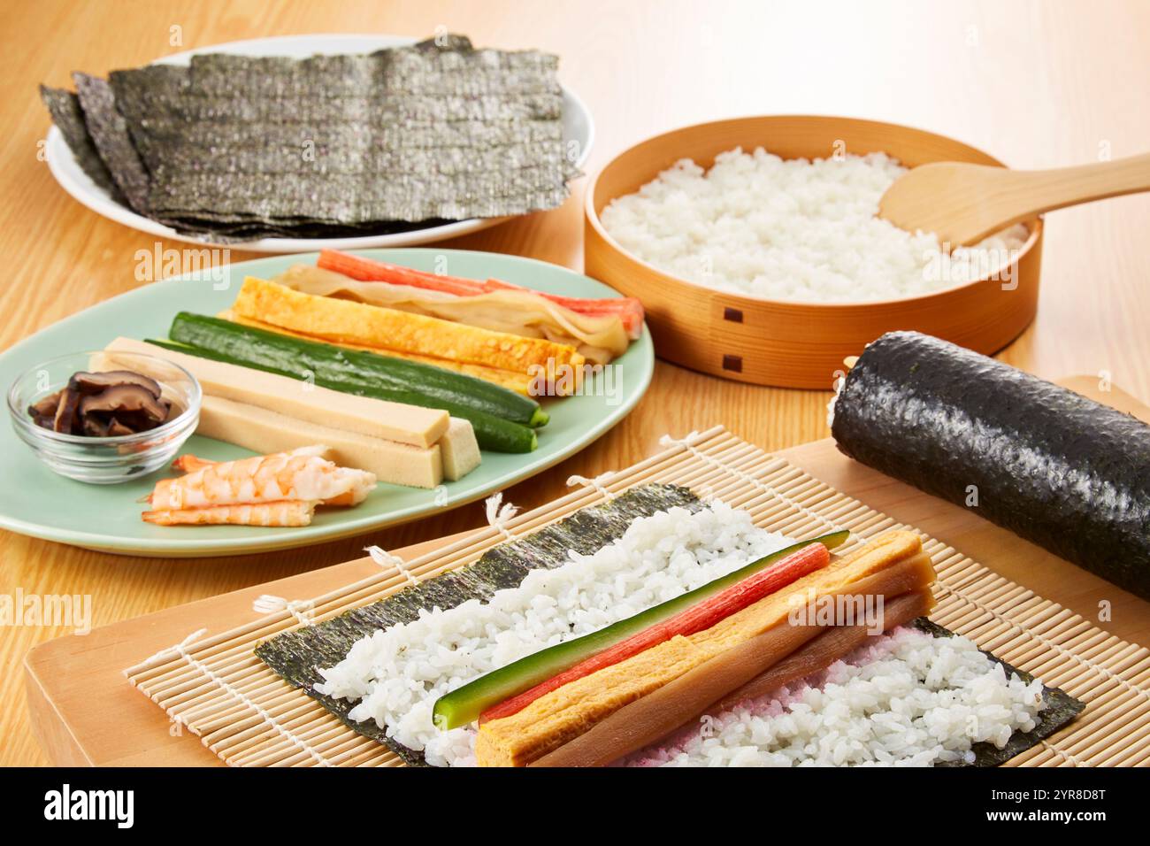 Rolled sushi Cooking scene Stock Photo - Alamy