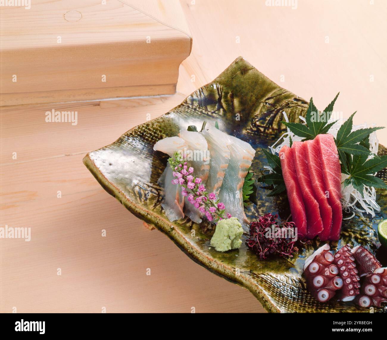 Assorted sashimi served at the sushi bar counter Stock Photo - Alamy