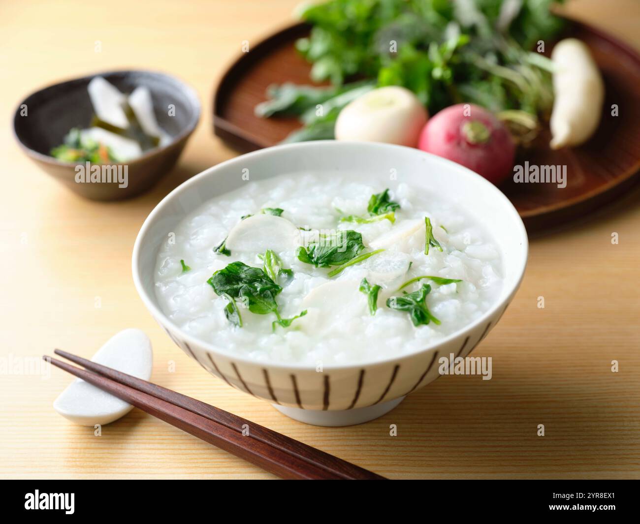 Rice gruel with seven herbs and pickles Stock Photo - Alamy