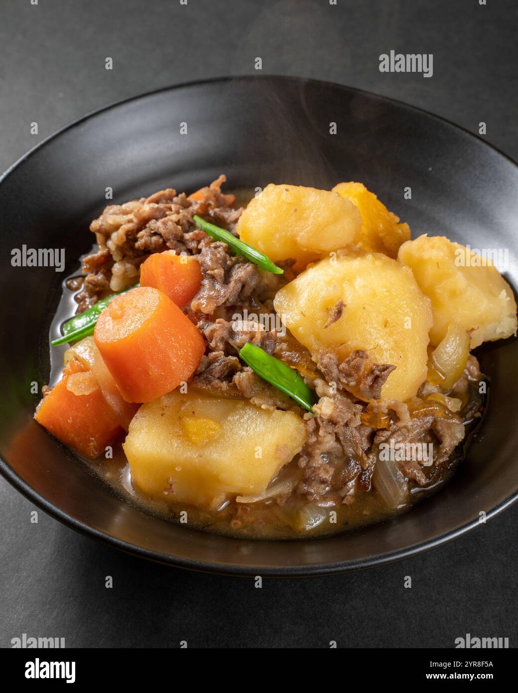 Nikujaga, Potatoes and Meat Simmered in Sweetened Soy Sauce Stock Photo ...