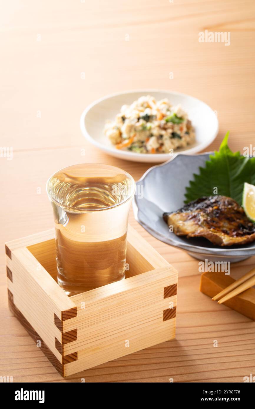 Cold sake and snacks Stock Photo - Alamy