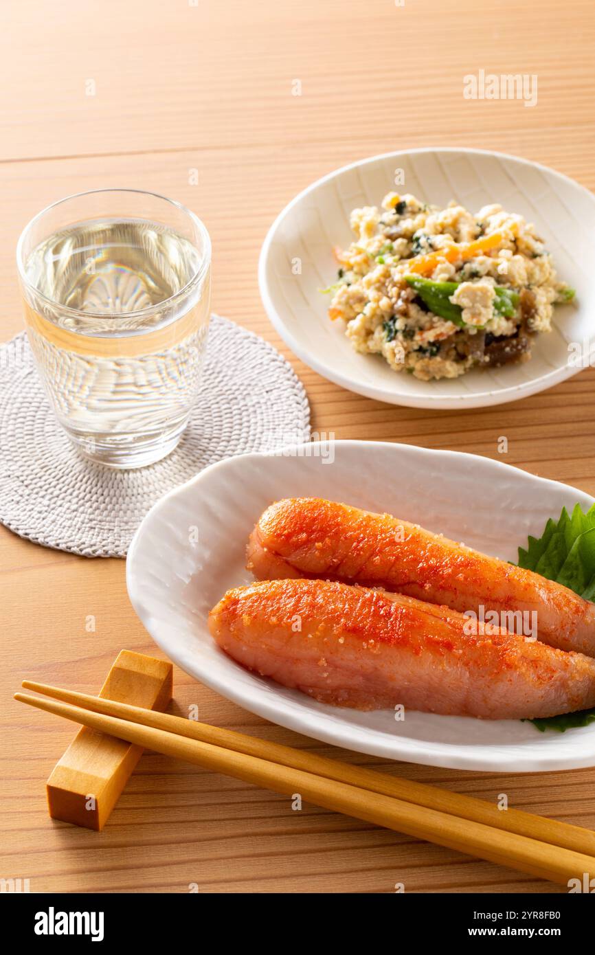 Spicy cod roe and cold sake Stock Photo - Alamy