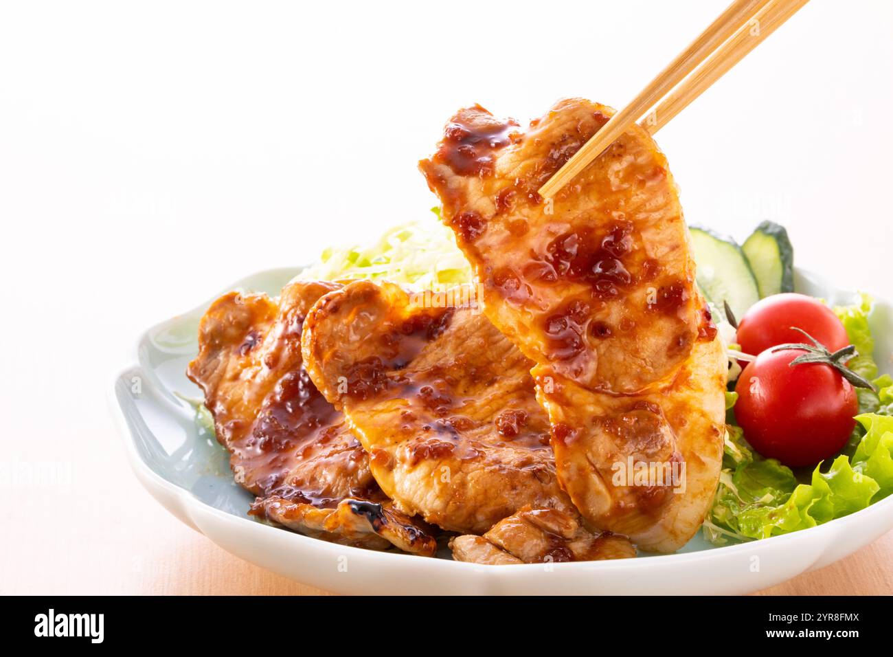 Eating ginger-grilled pork Stock Photo - Alamy