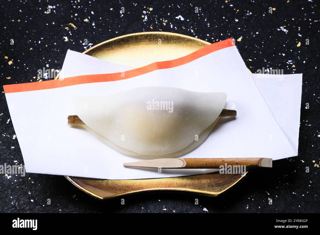 New Year's lucky rice cake with petals Stock Photo - Alamy