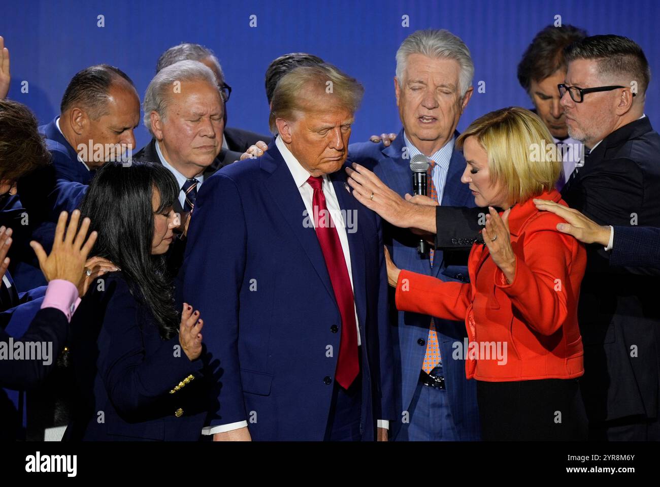 Republican presidential nominee former President Donald Trump is prayed ...