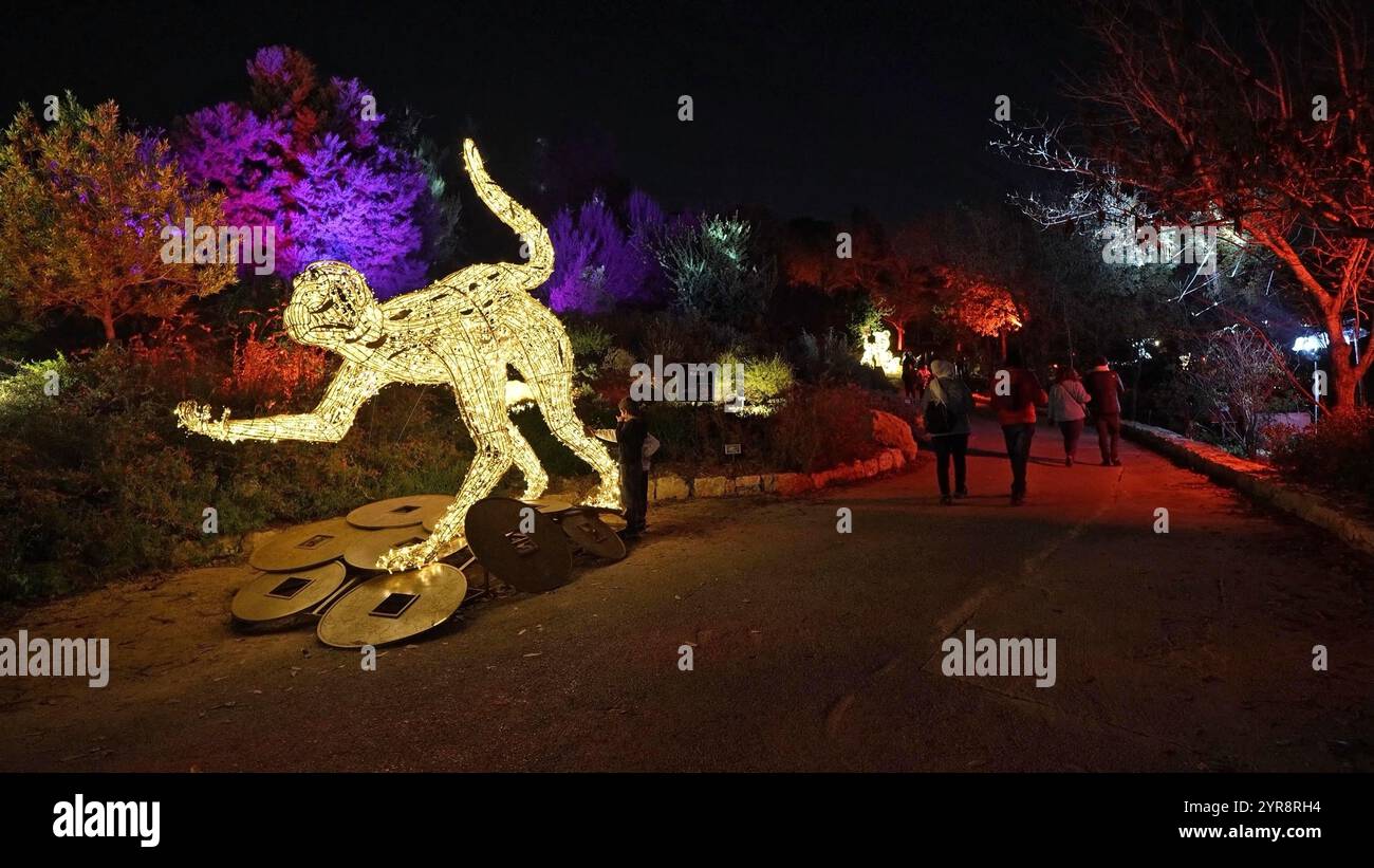 JERUSALEM - DECEMBER 2: Israelis pass by led light sculpture in shape ...