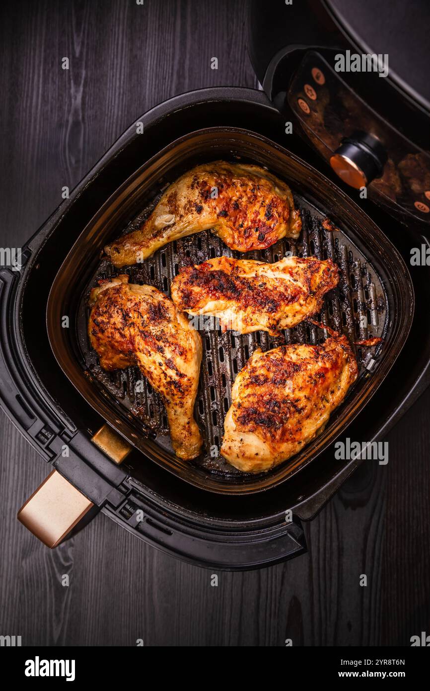 Chicken legs and pieces prepared in airfryer, modern cooking ...