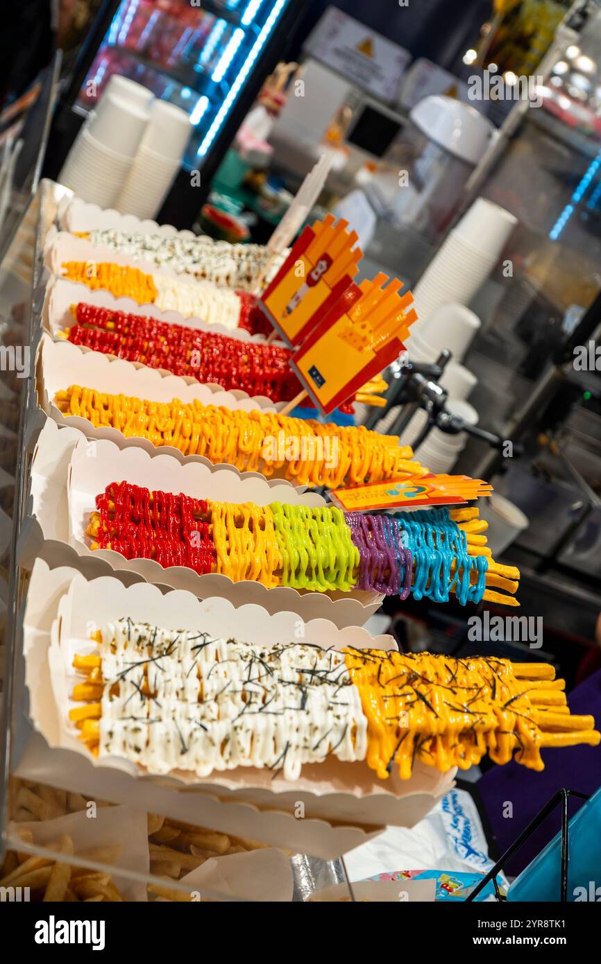 Colorful candy-coated treats arranged beautifully at a vibrant fair ...