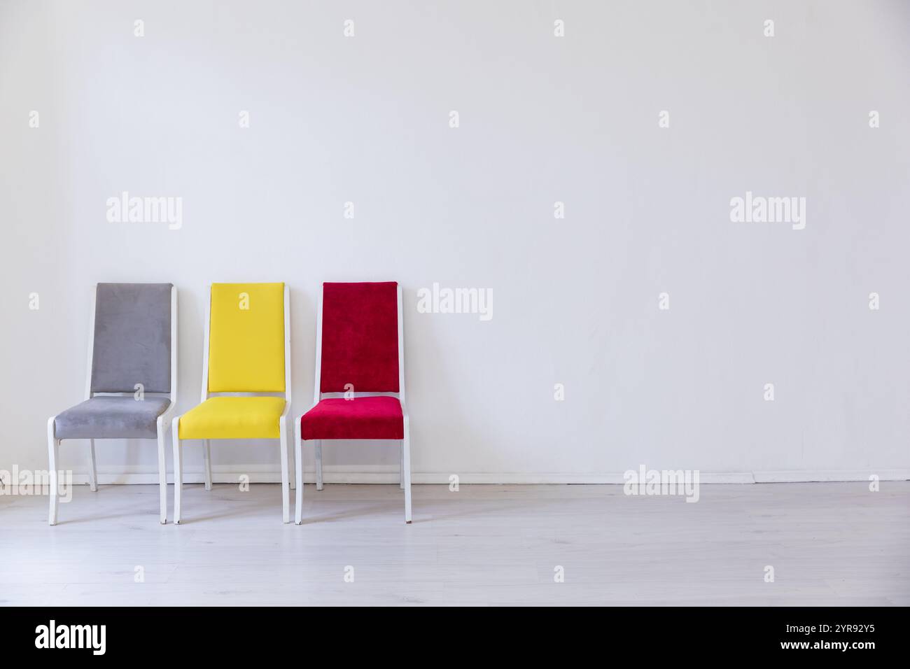 Three chairs in the interior of an empty white room Stock Photo - Alamy