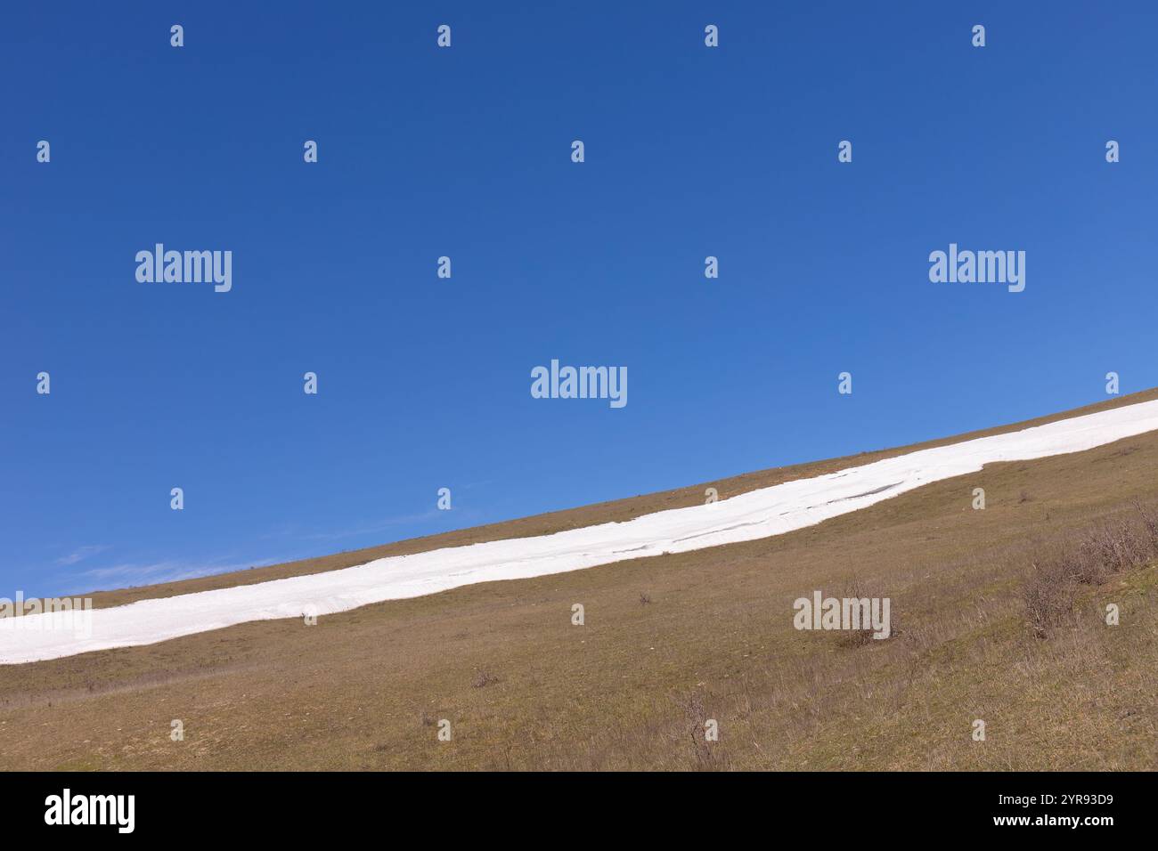 The slope has smooth snow and blue skies Stock Photo - Alamy
