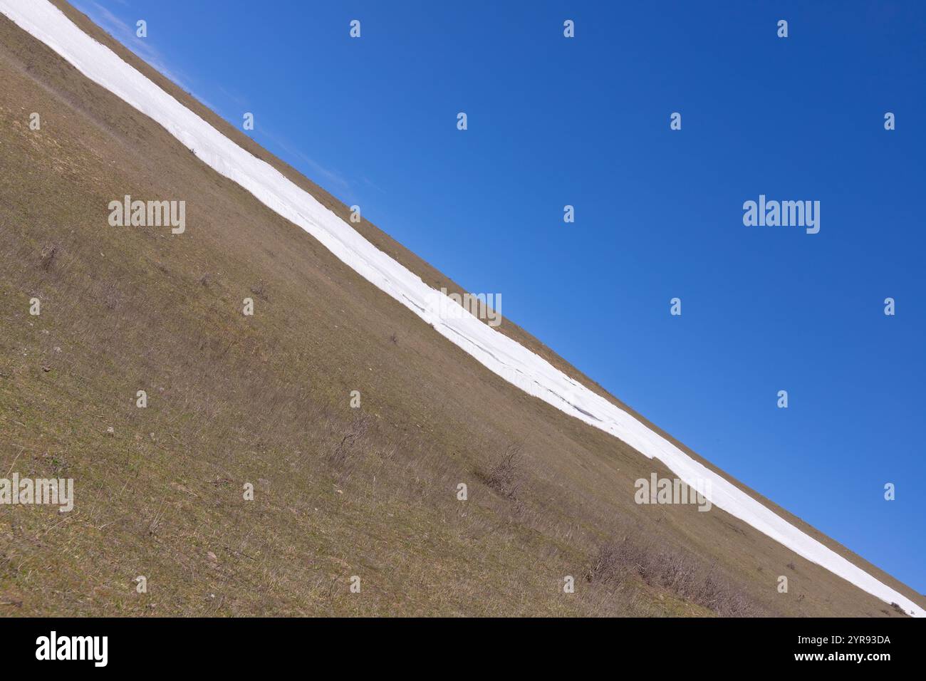 The slope has smooth snow and blue skies Stock Photo - Alamy