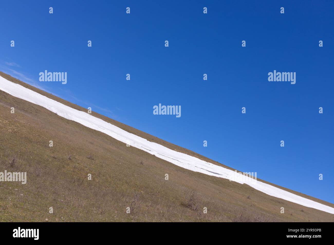 The slope has smooth snow and blue skies Stock Photo - Alamy