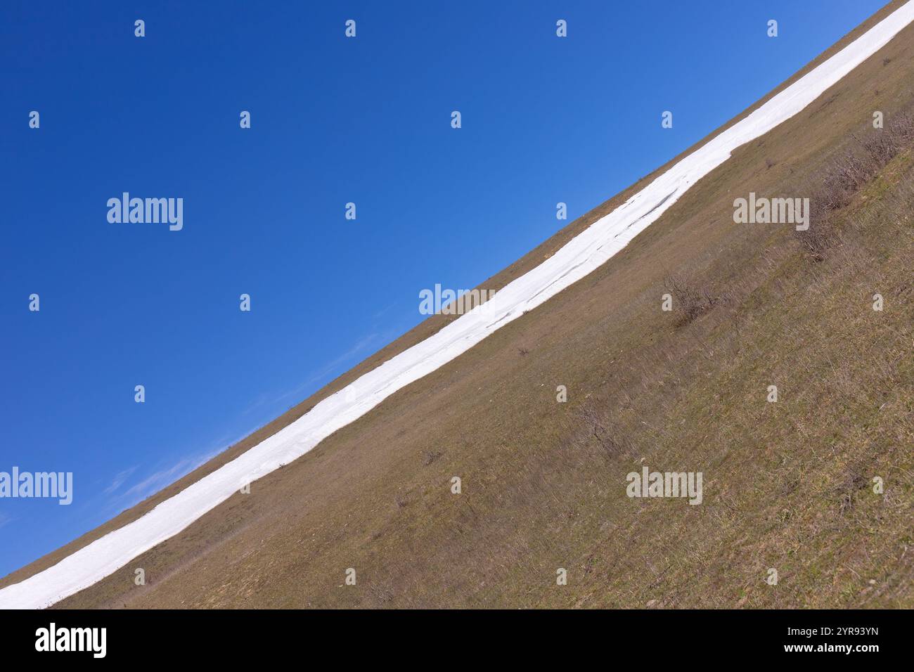 The slope has smooth snow and blue skies Stock Photo - Alamy