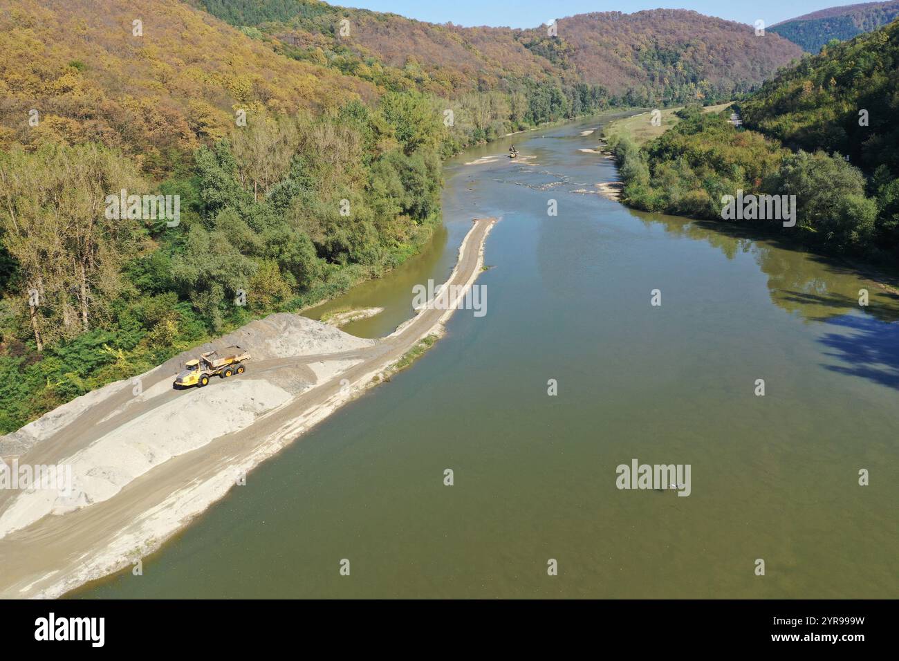 Aerial view of illegal exploitation of river sand and gravel with ...