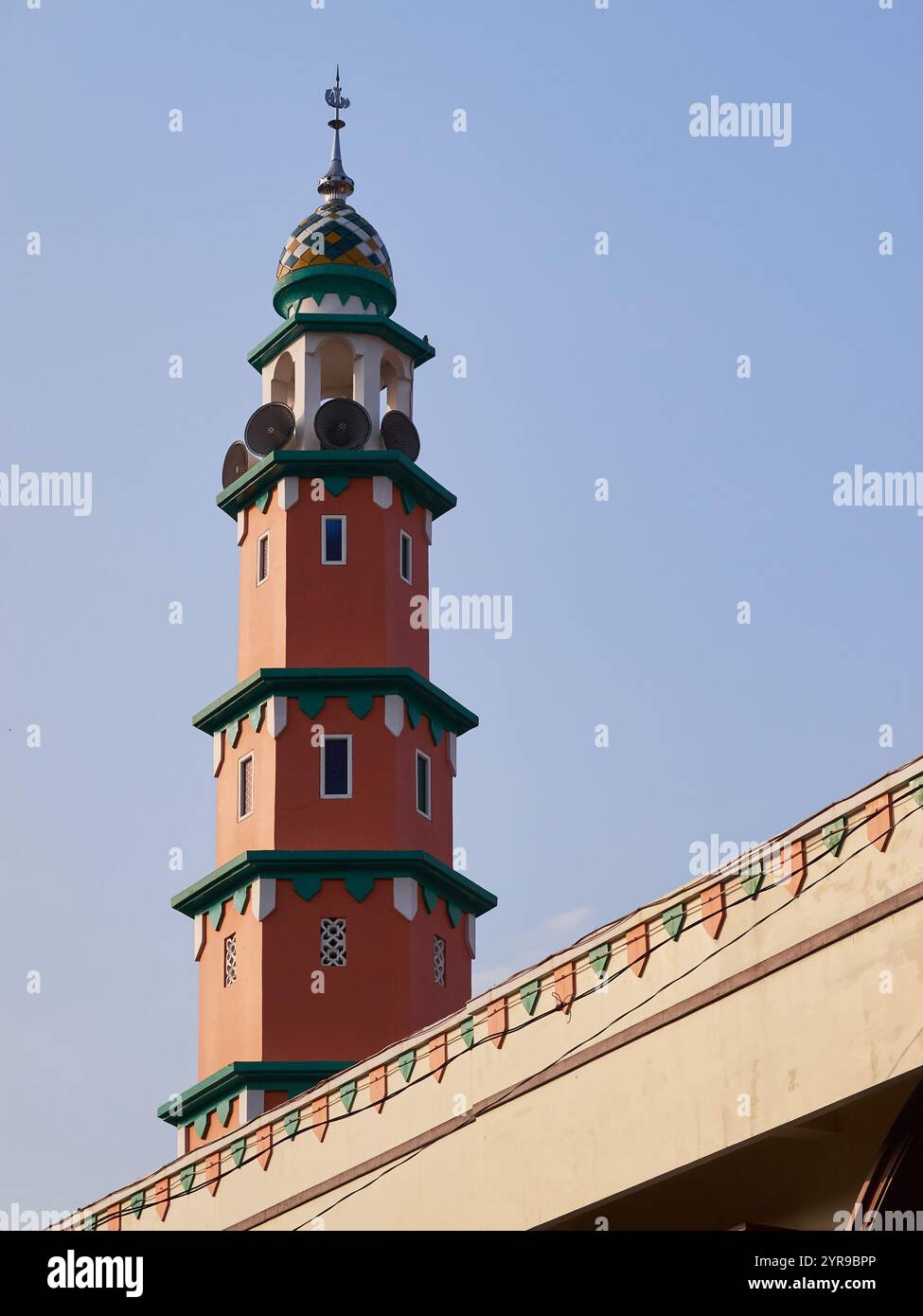 a towering mosque minaret with its dome in Arabic architectural style ...