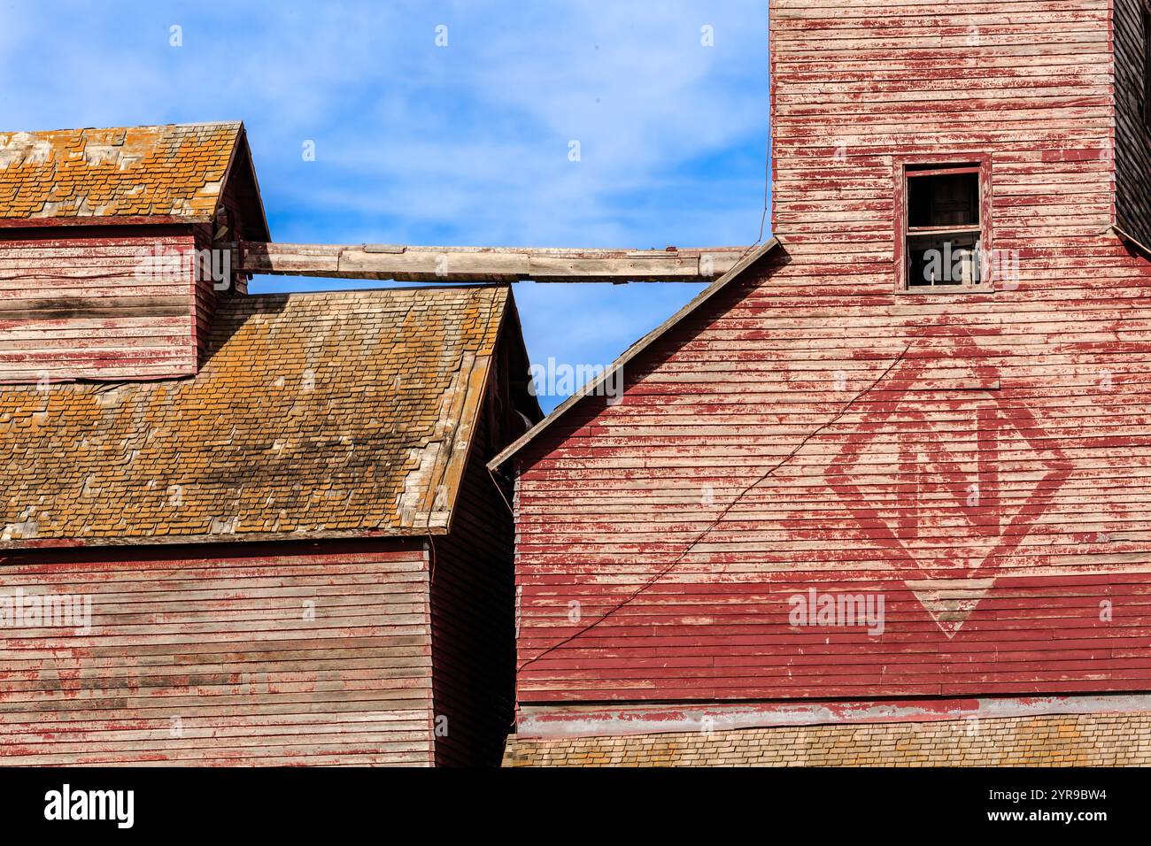 A red building with a white lettering on the side. The lettering is a ...