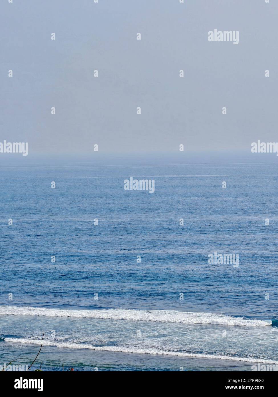 The calm ocean horizon stretches endlessly, where the tranquil blue of ...