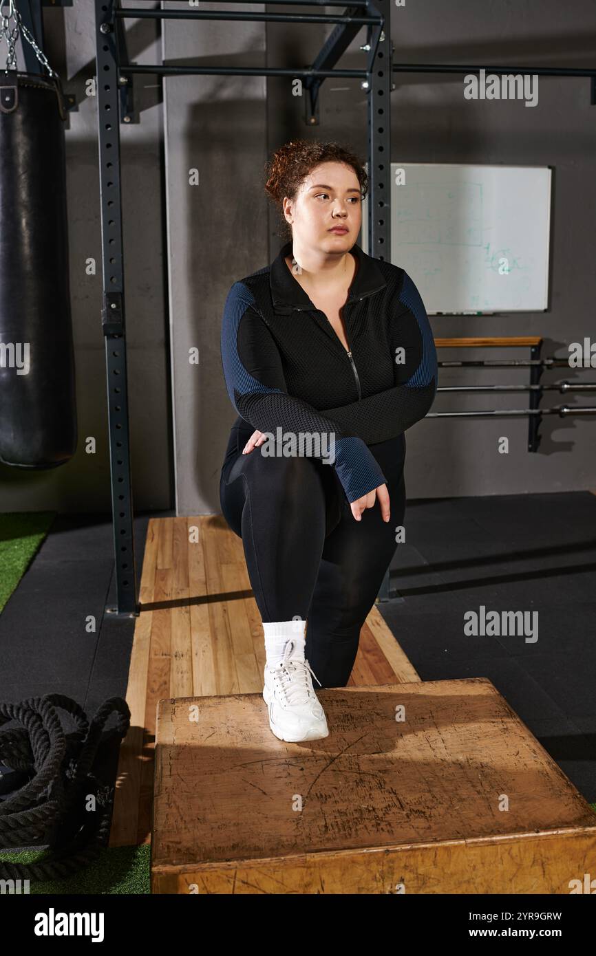 Dedicated woman demonstrating focus and determination in workout ...