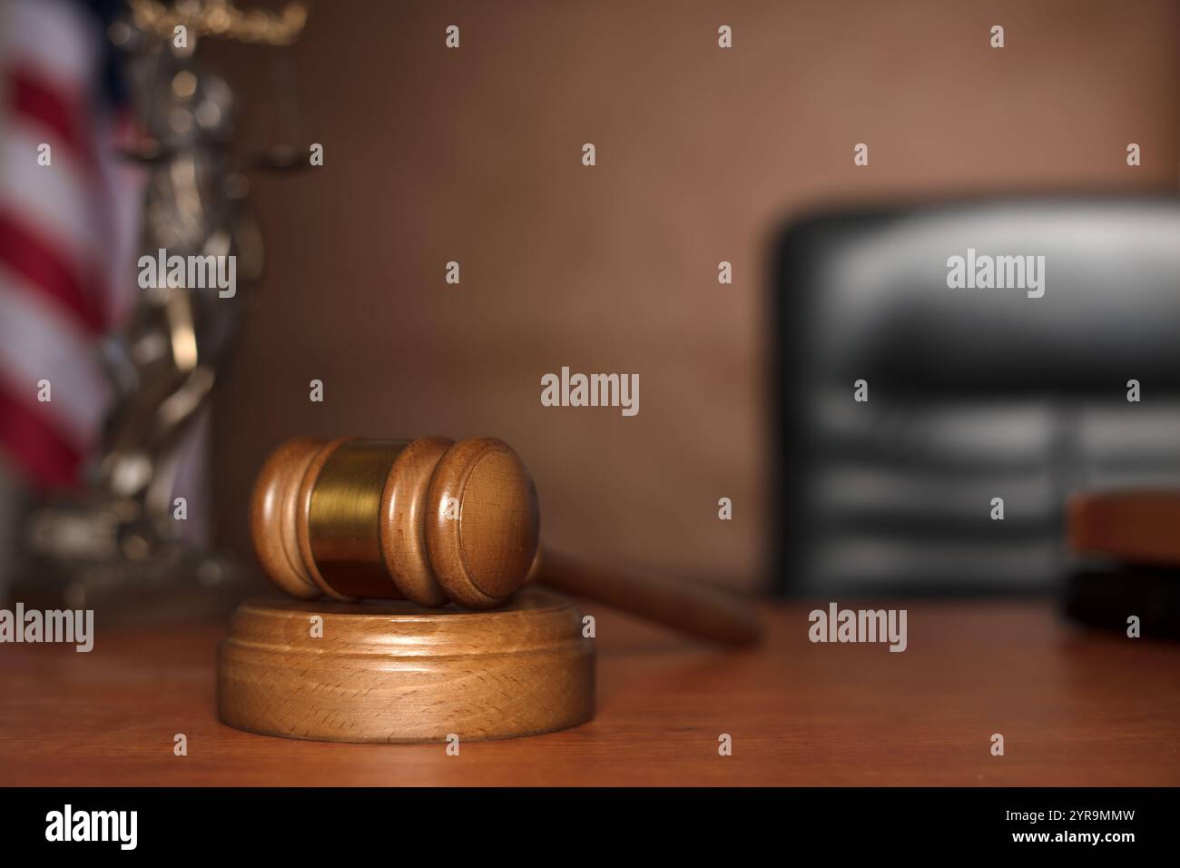 Wooden gavel standing on judge's table Stock Photo - Alamy