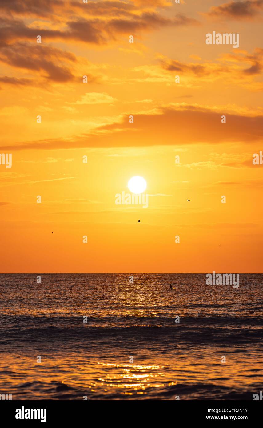 Beautiful cloudscape over the sea, sunrise shot, vertical Stock Photo ...