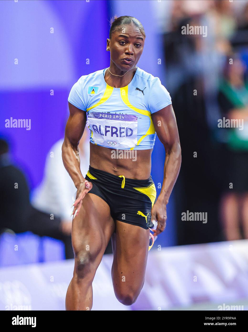 Julien Alfred participating in the 200 meters relay at the Paris 2024 ...