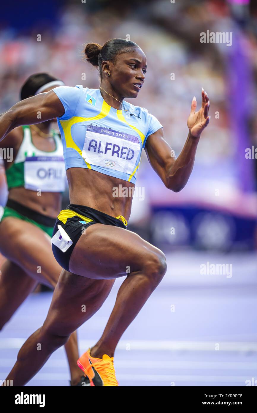 Julien Alfred participating in the 200 meters relay at the Paris 2024 ...