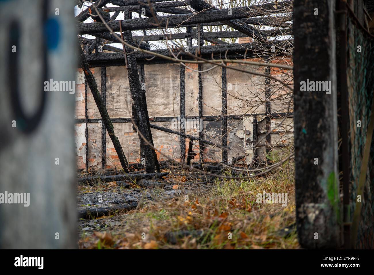 Old abandoned freight yard building with burn marks and vandalism. High ...