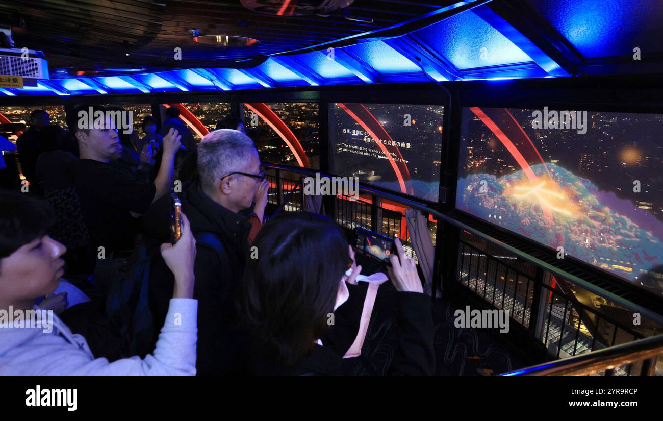 Some images are projected onto a translucent sheet along with the ...