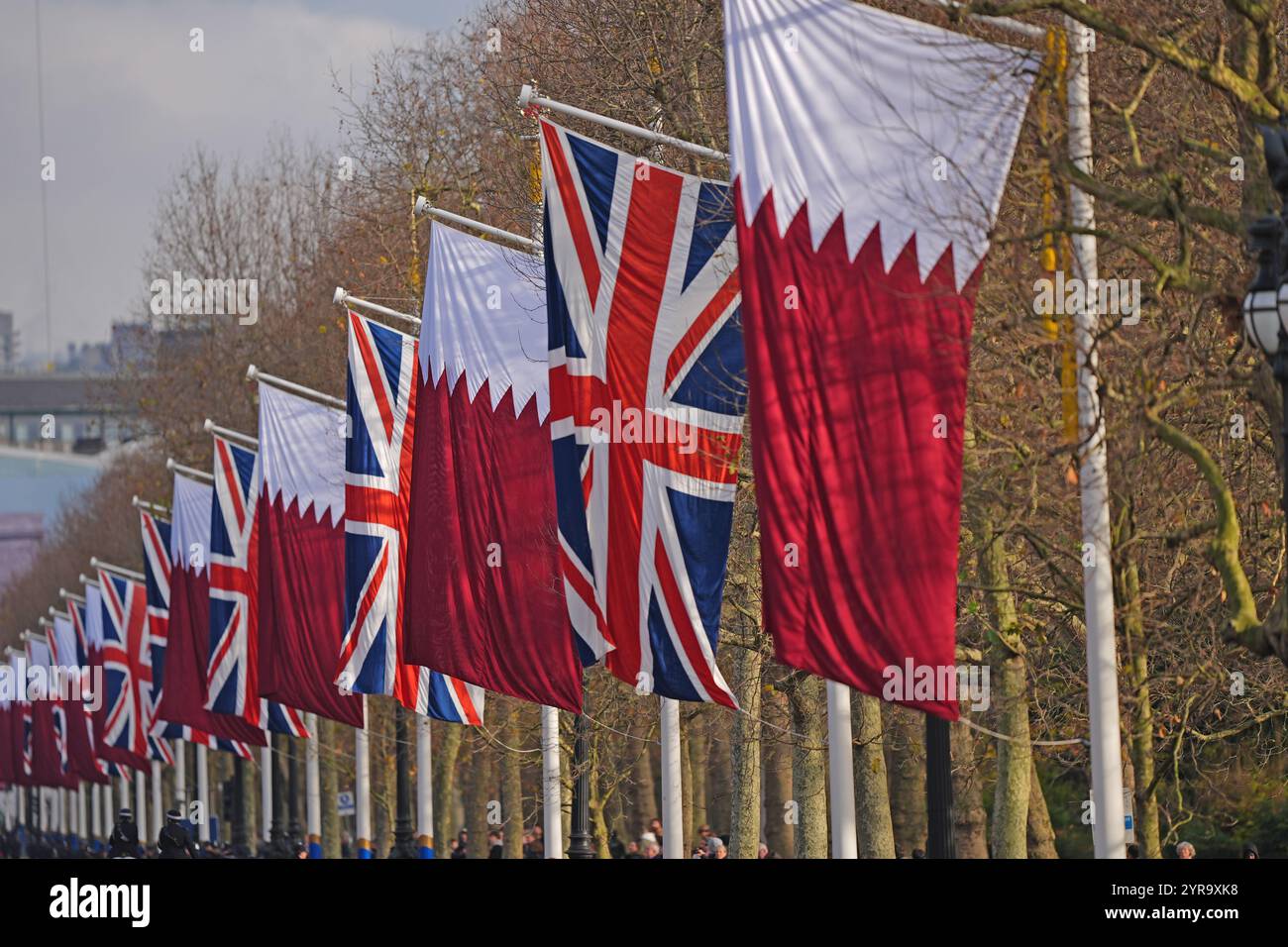 Union flags and flags of Qatar line The Mall in London, during the ...