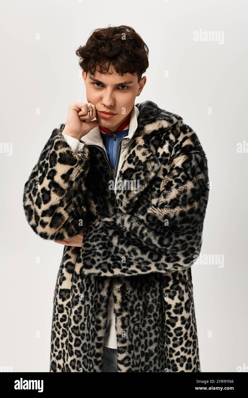 Confident man poses in a trendy leopard print coat, embodying ...