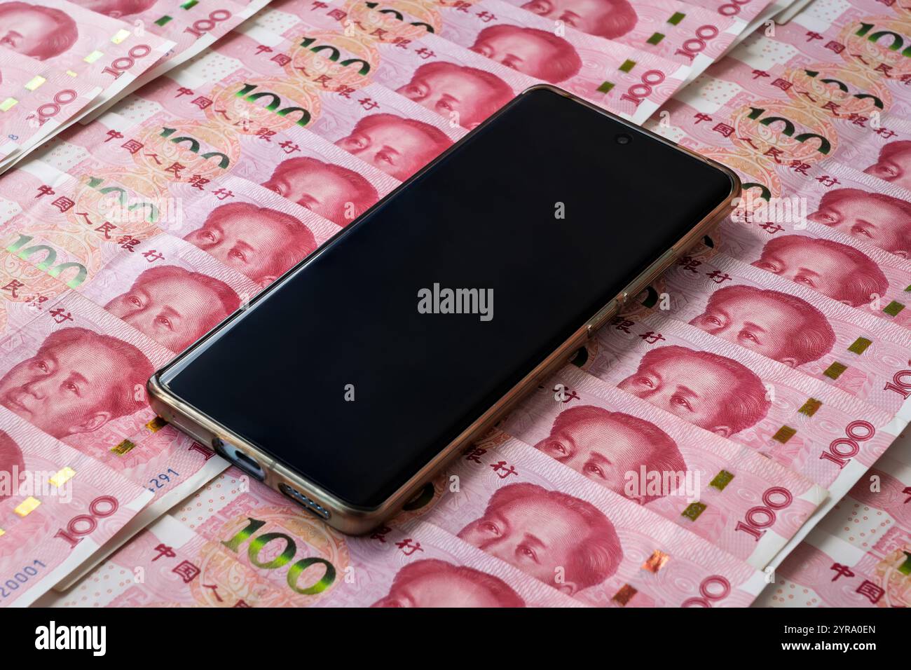 smartphone screen on Chinese yuan banknotes background for design ...