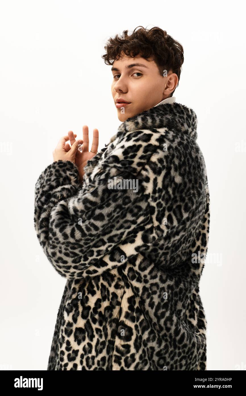 Handsome man showcases his unique style in a chic leopard print coat ...