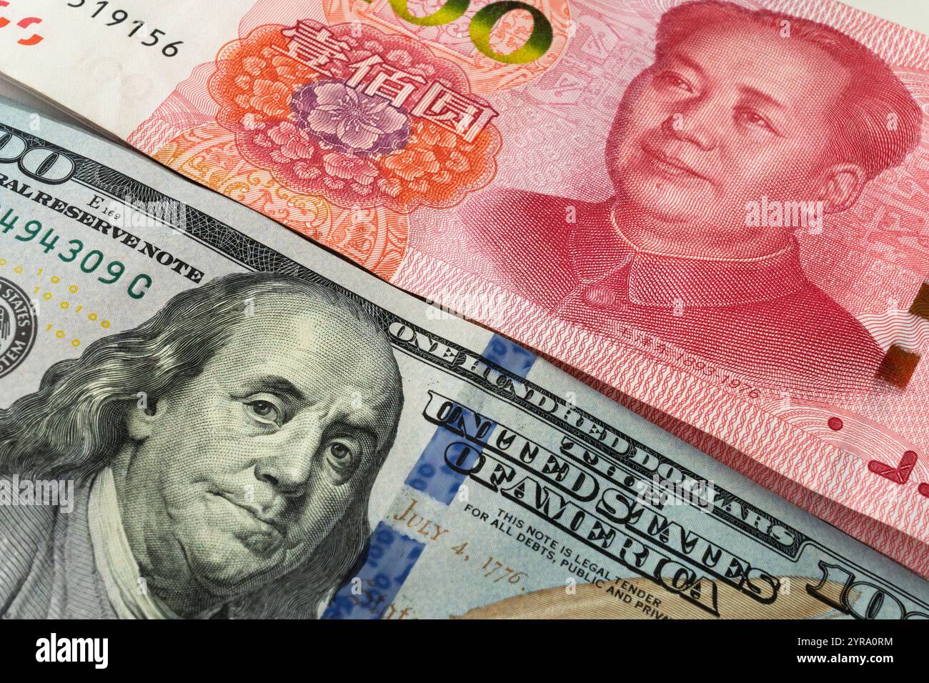 Chinese currency yuan and U.S. dollars amerkinaische bills. The concept ...
