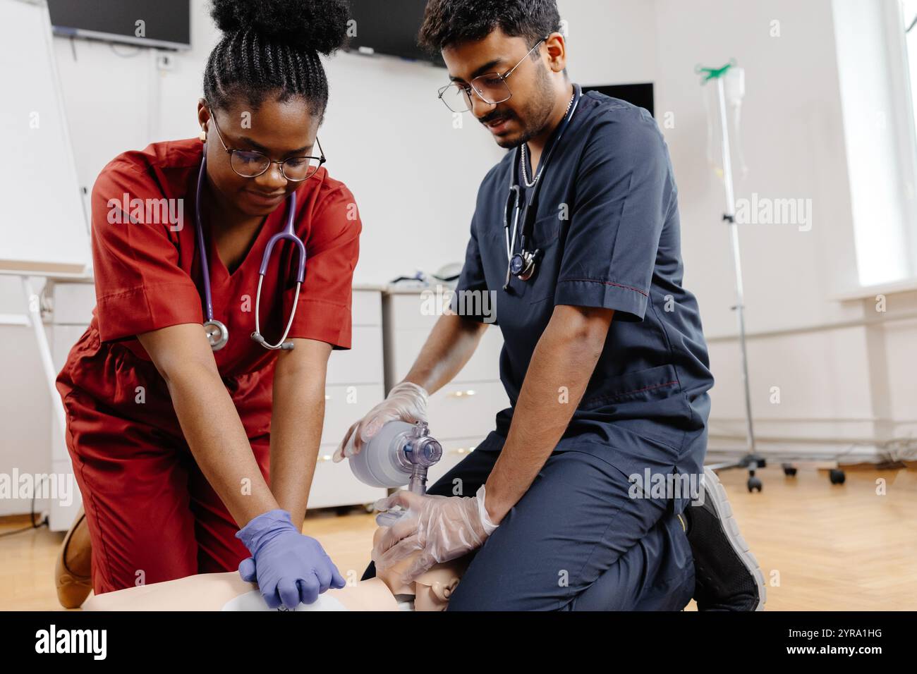Emergency medical professionals assisting hi-res stock photography and ...