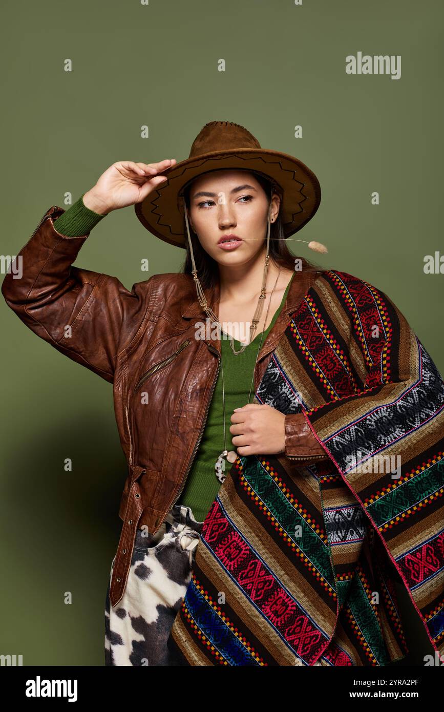 Brunette woman poses confidently, wearing striking traditional garments ...