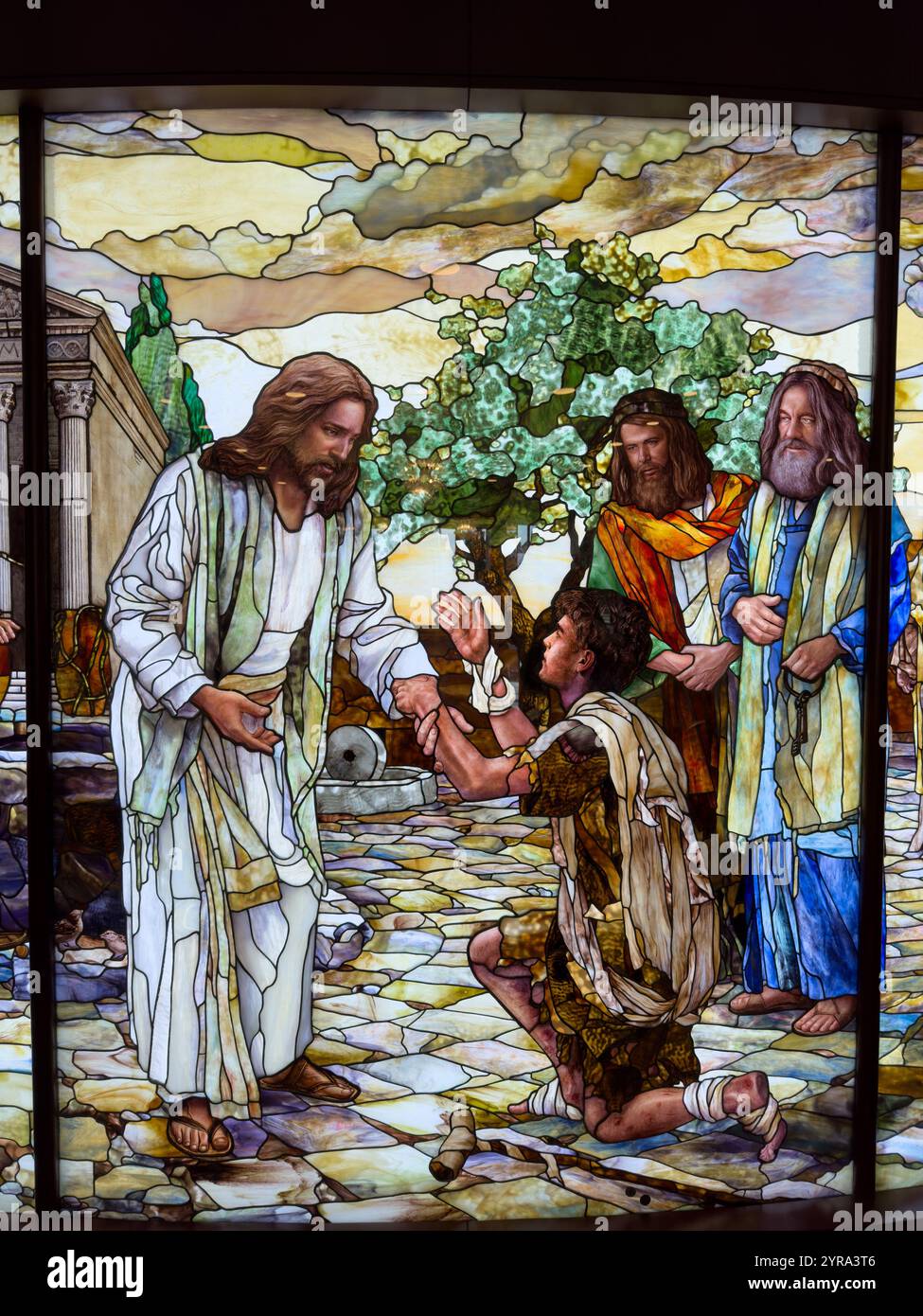 A stained glass wall in the Rome Temple Visitors Center depicting ...