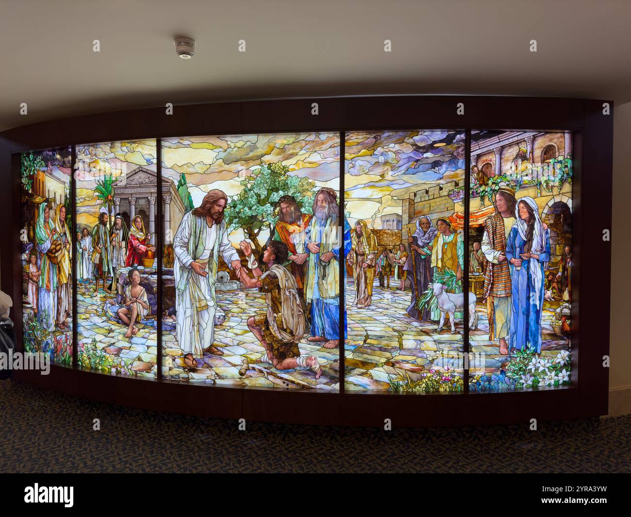 A stained glass wall in the Rome Temple Visitors Center depicting ...