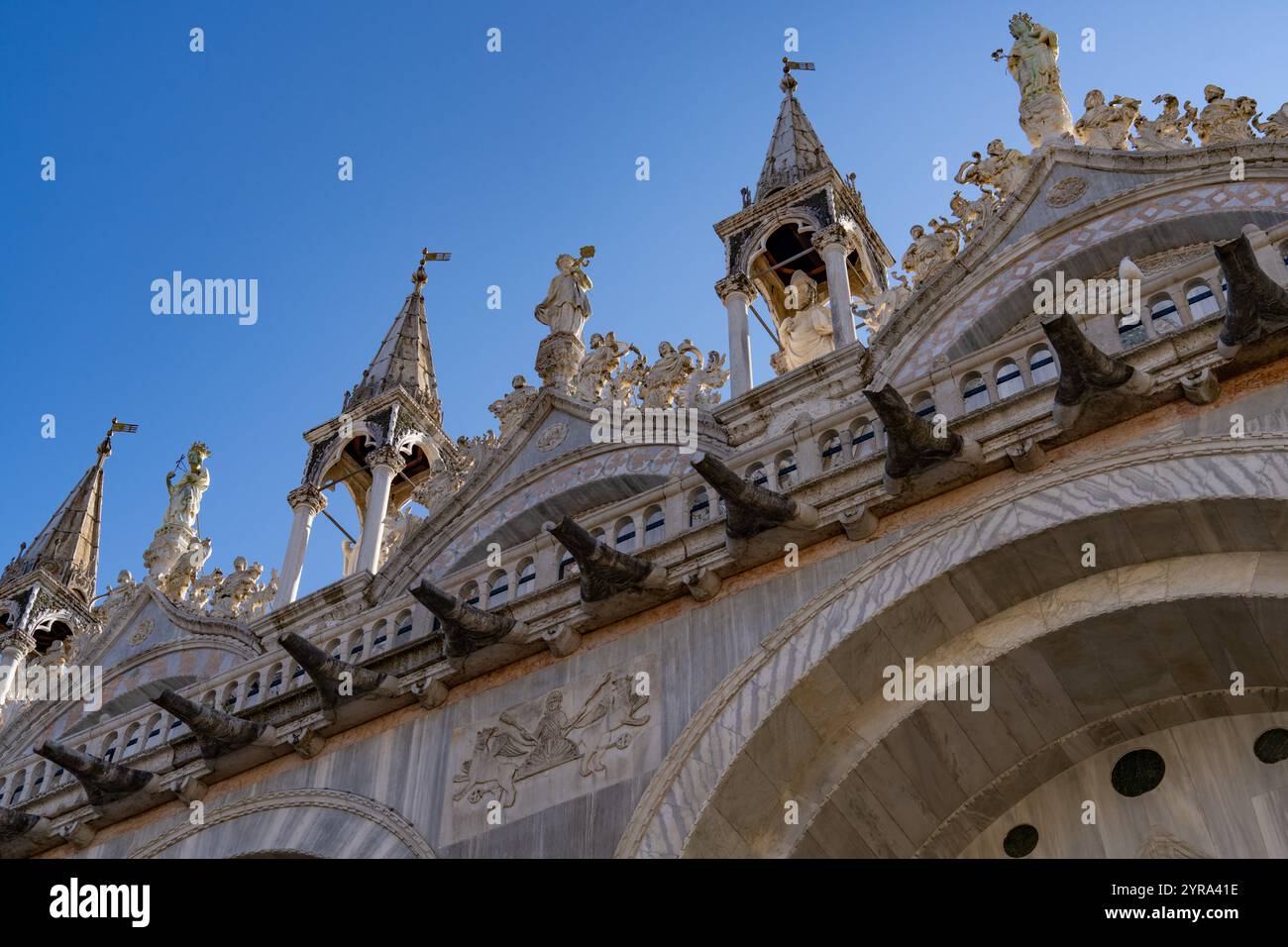 Gothic towers & statues on the north side of St. Mark's Basilica in ...