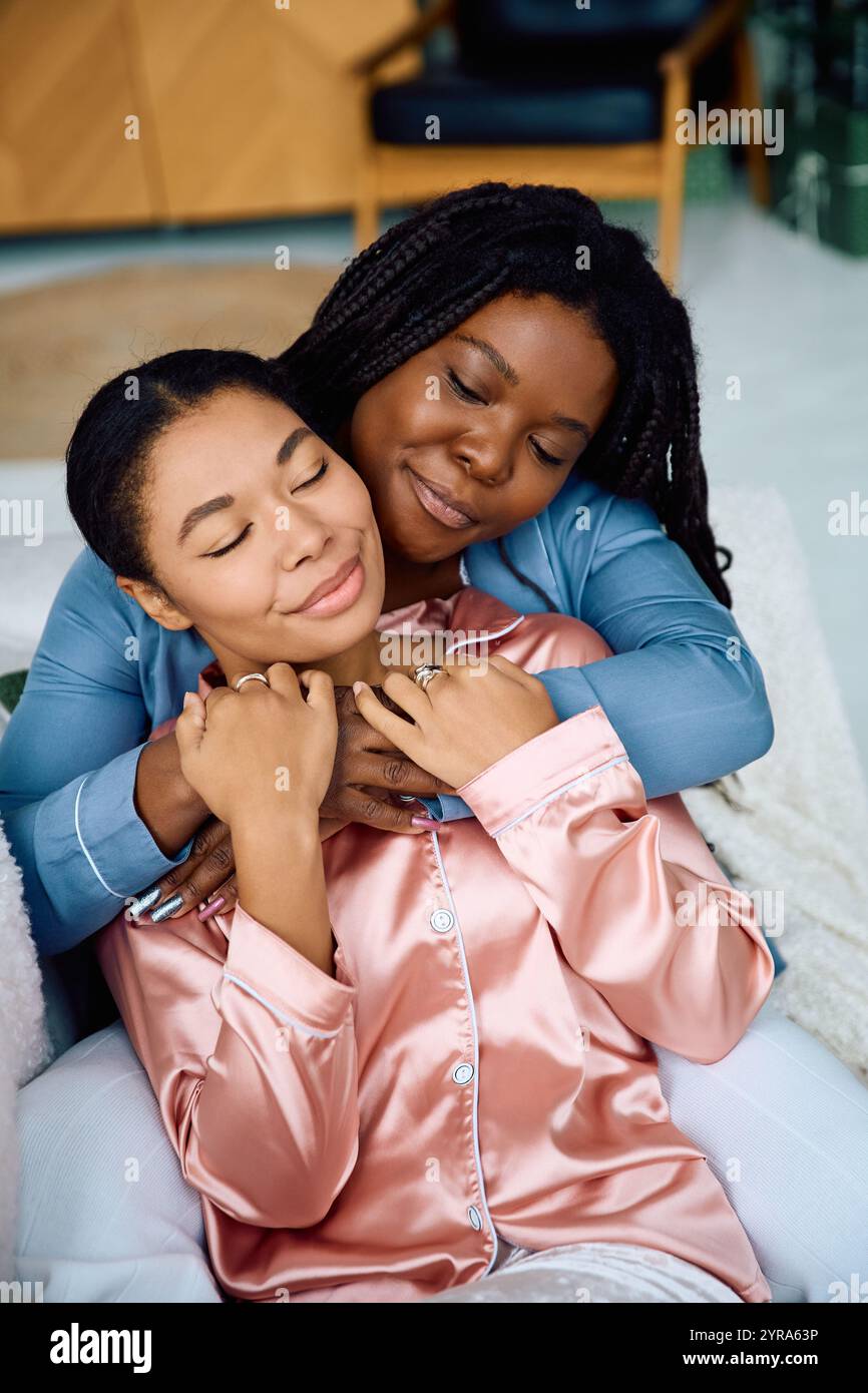 A loving couple enjoys each others affection in a warm and inviting ...