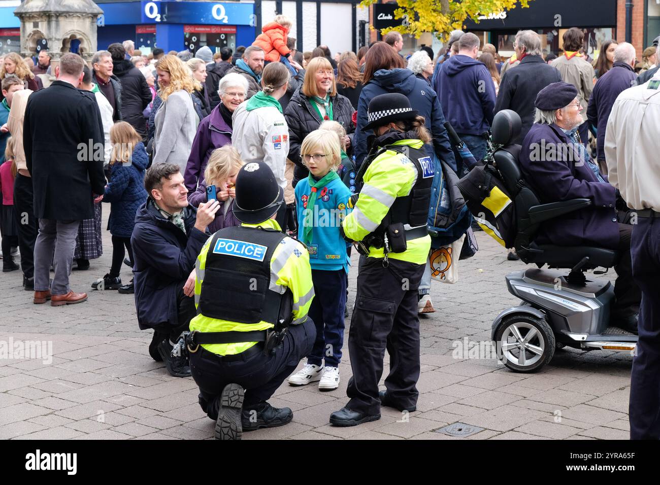 two loughborough police officers talking to a child on remembrance day ...