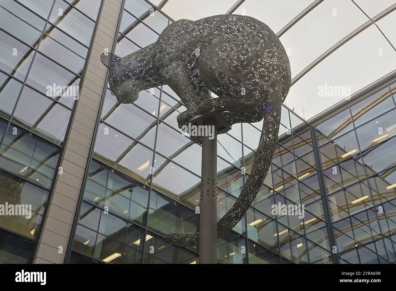 Poised sculpture a 5.5 metre high leopard on 10 metre high pole ...