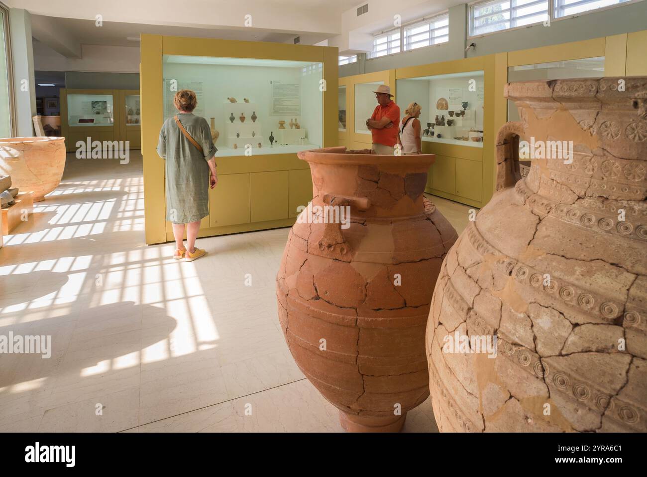 Sitia Archaeological Museum, view of large clay urns and displays whose ...