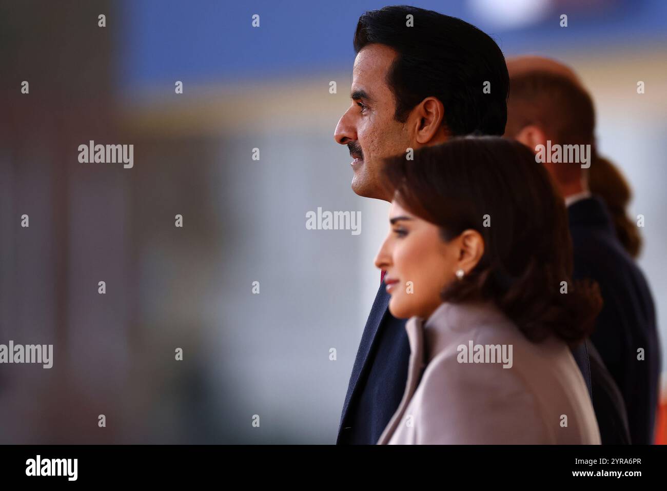Qatar's Emir Sheikh Tamim bin Hamad Al Thani and his wife Sheikha Jawaher stand during a ...