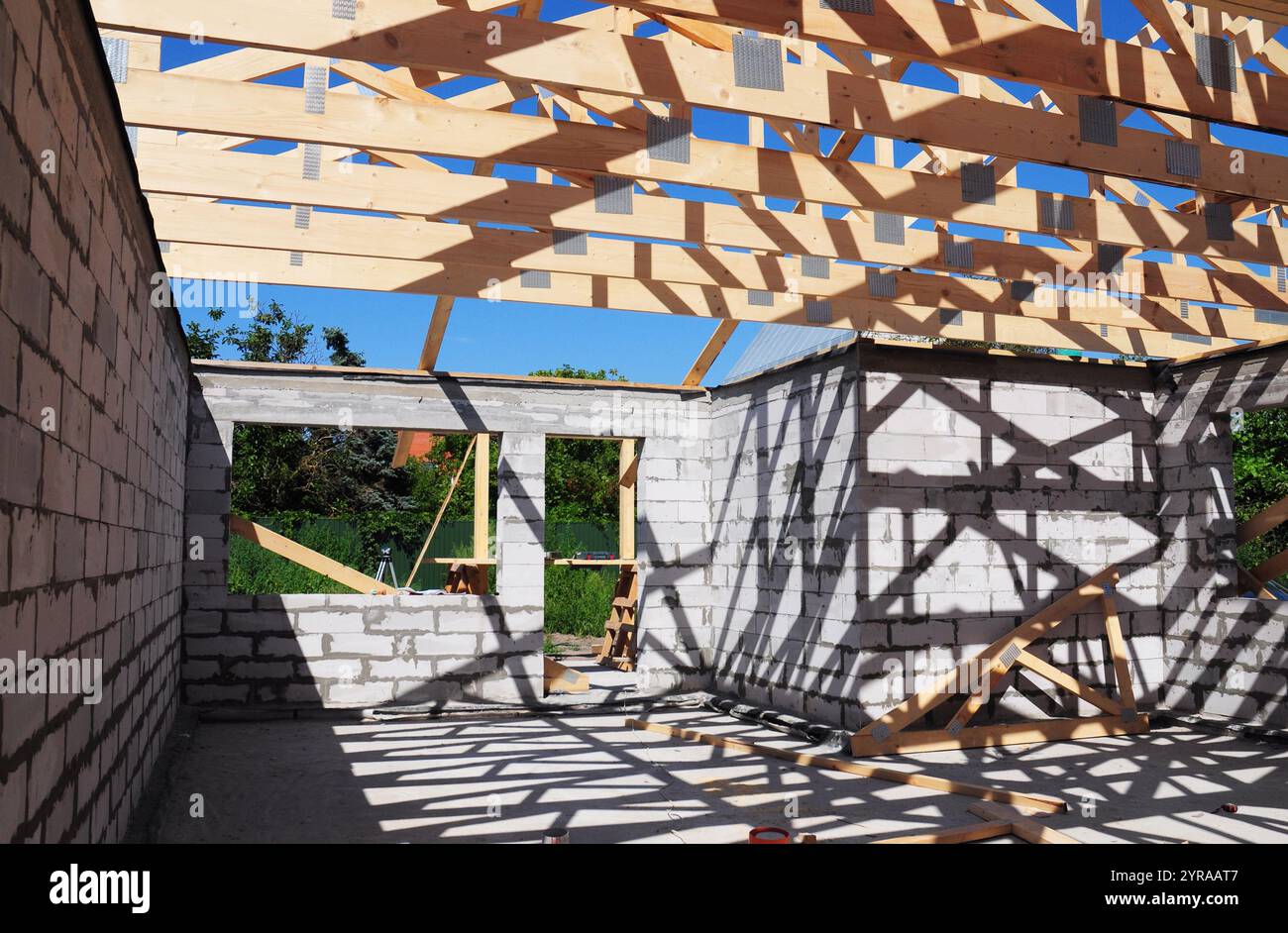 Close up on unfinished house framing roofing construction with rafter ...